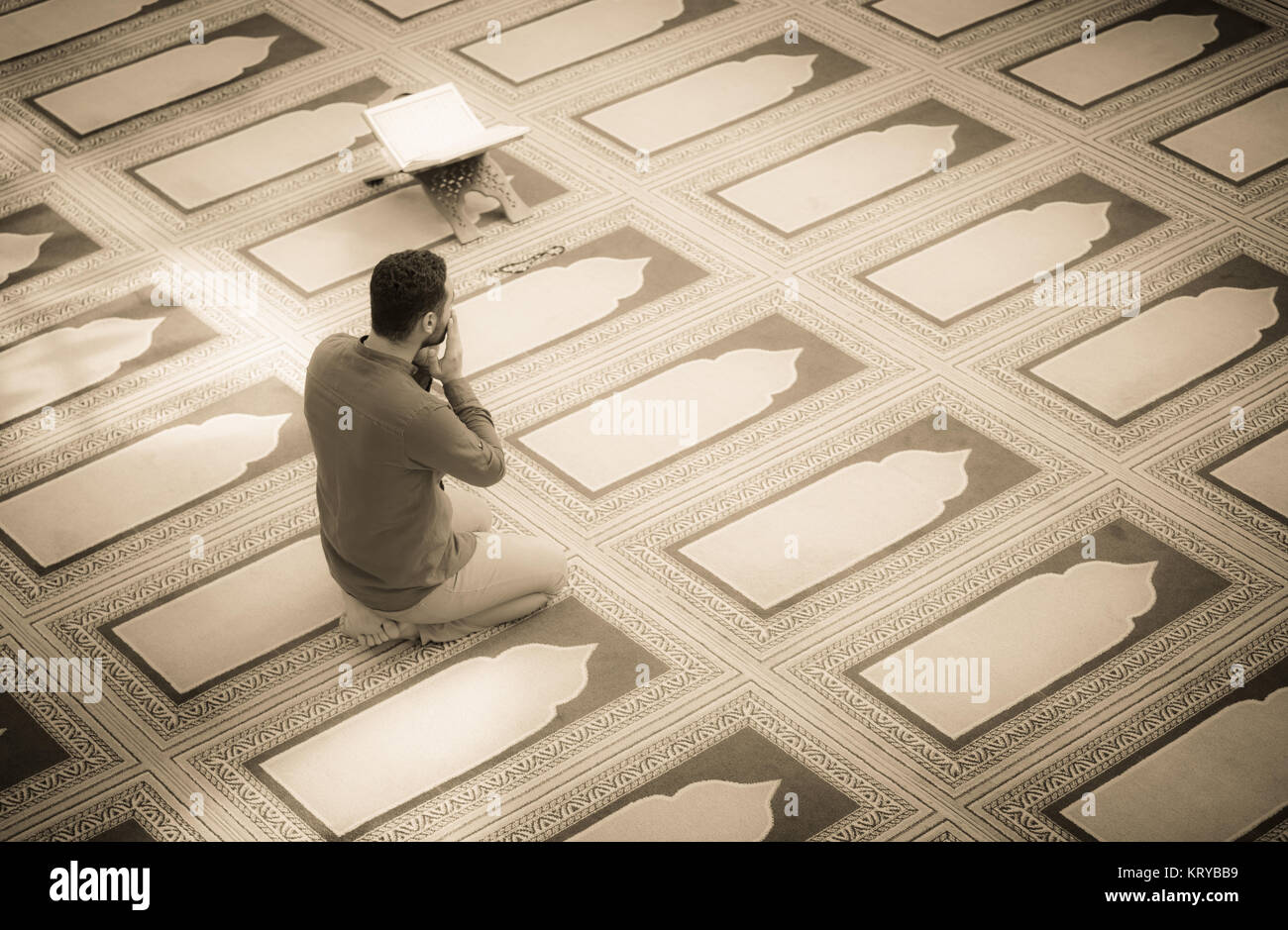 Religious muslim man praying inside the mosque Stock Photo - Alamy