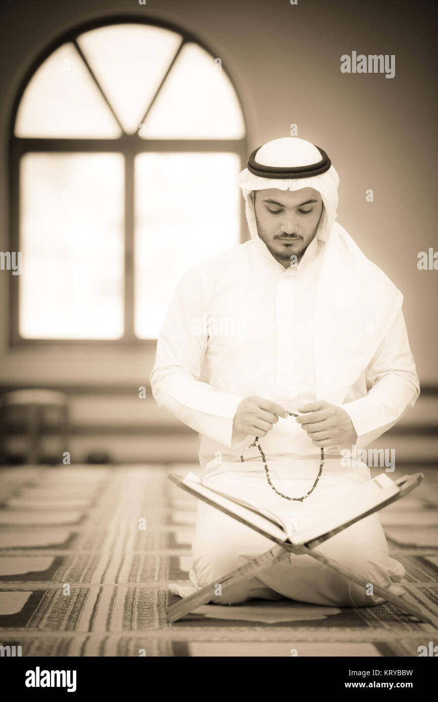 Religious muslim man praying inside the mosque Stock Photo - Alamy