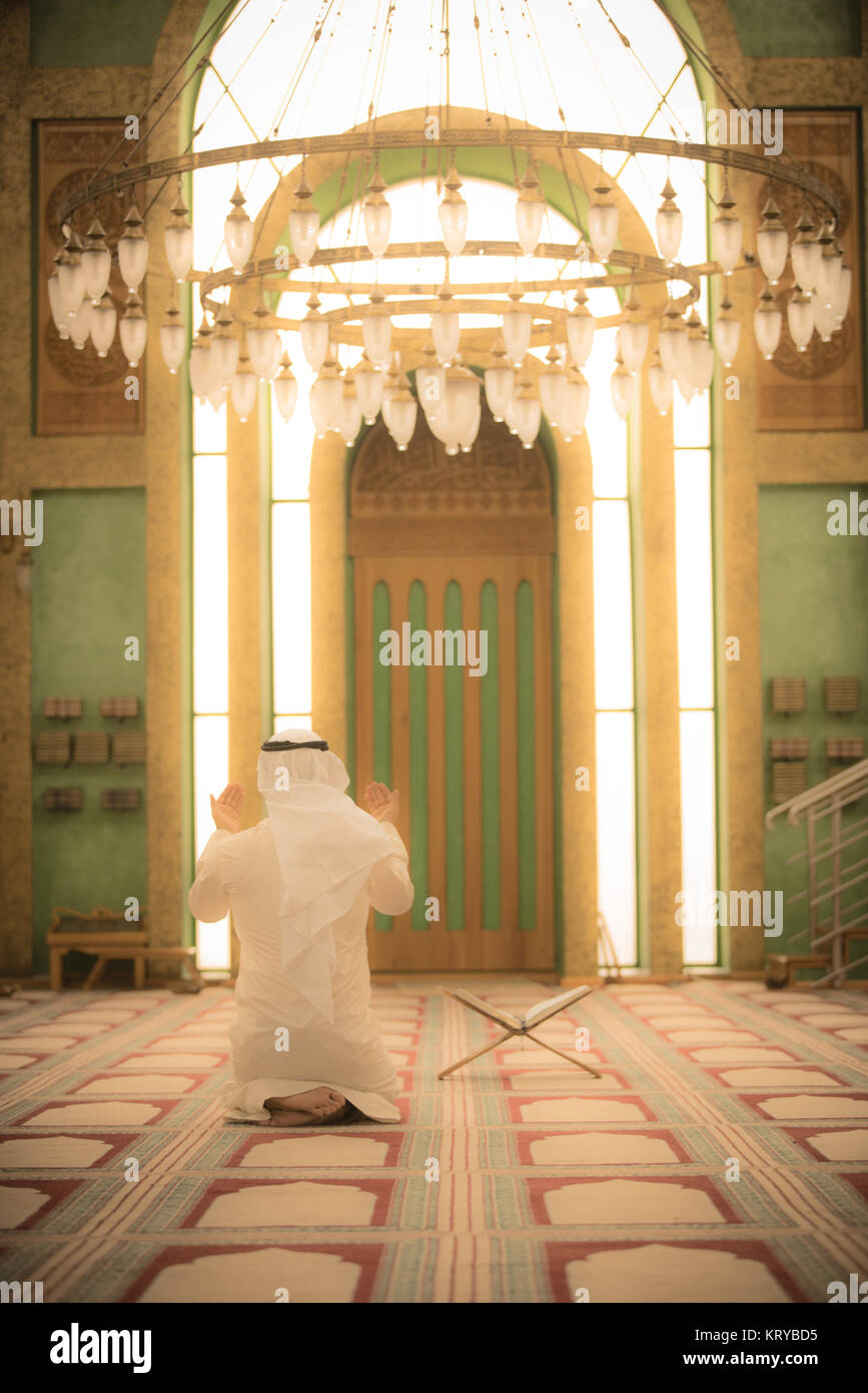 Religious muslim man praying inside the mosque Stock Photo - Alamy