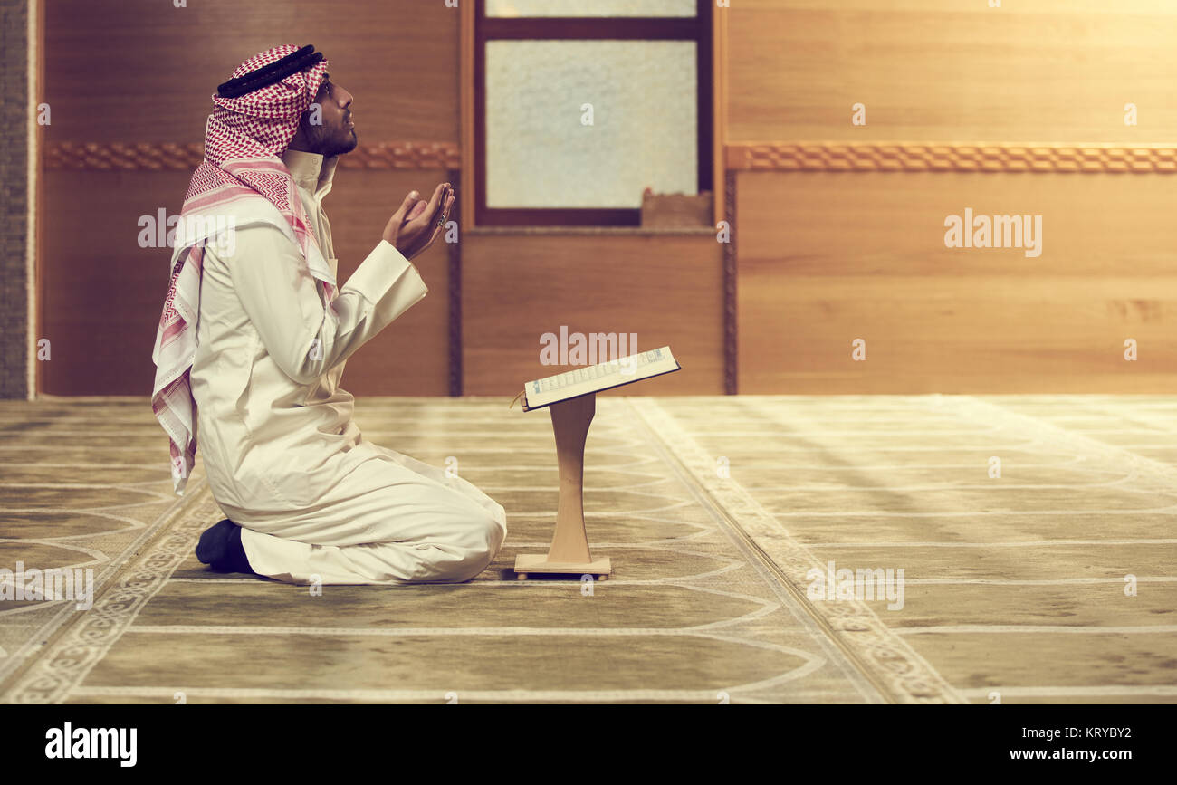 Religious muslim man praying inside the mosque Stock Photo - Alamy