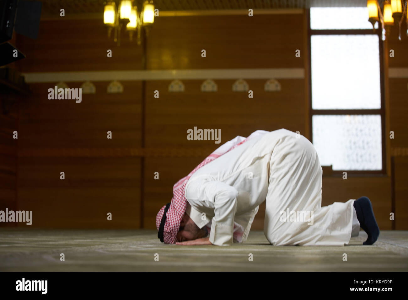 Religious muslim man praying inside the mosque Stock Photo - Alamy