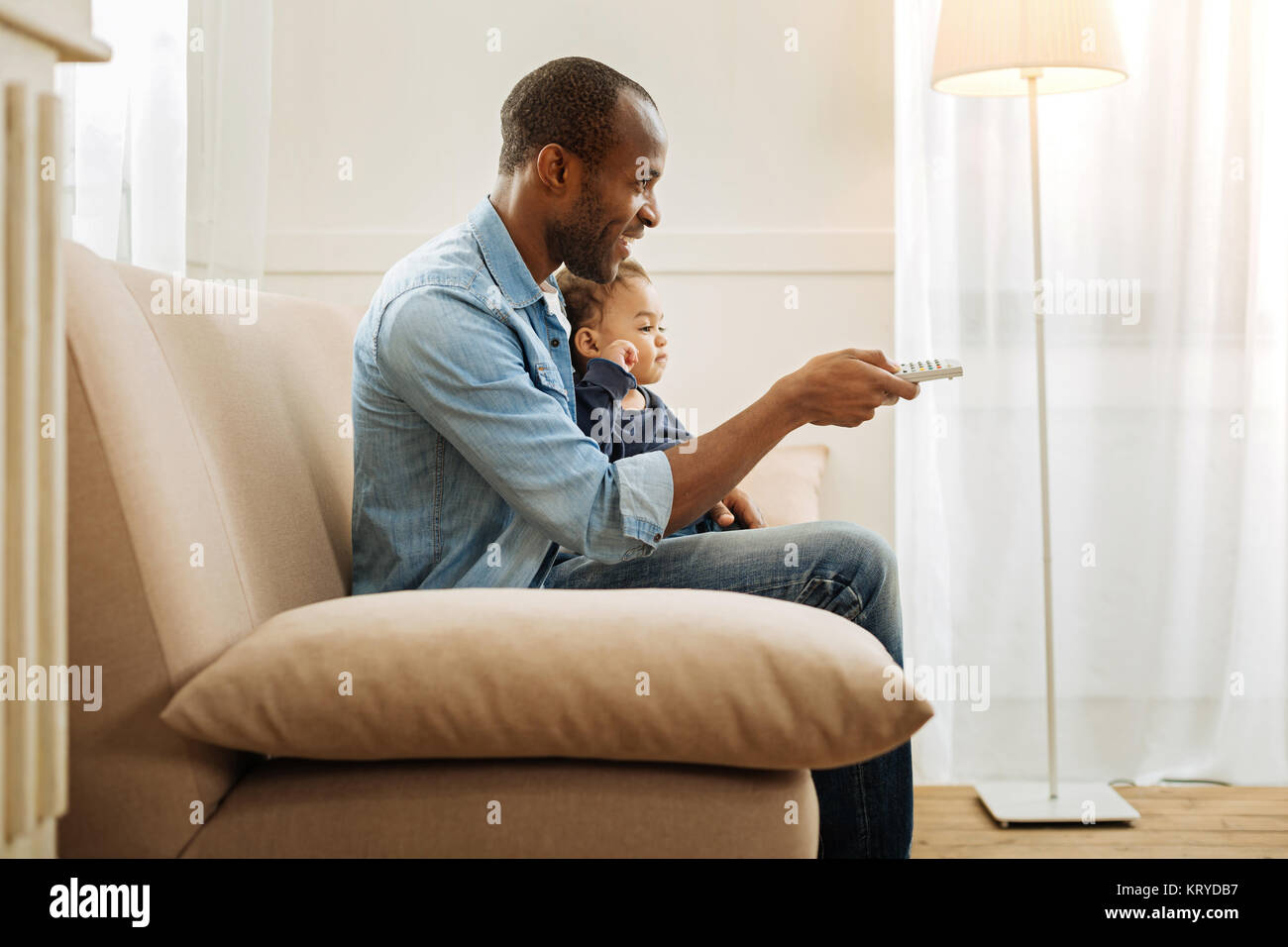 Loving daddy relaxing with his son Stock Photo - Alamy