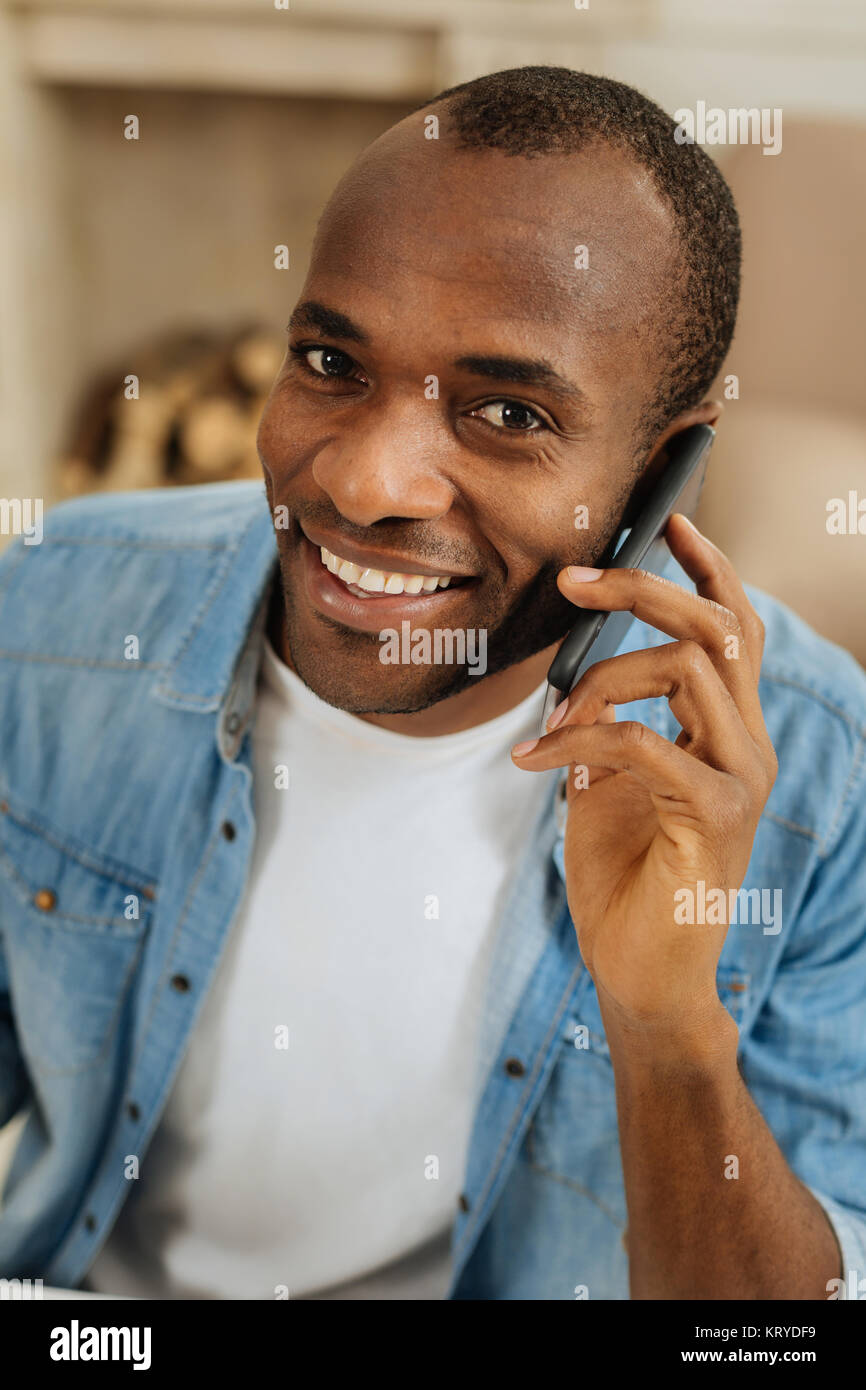 Inspired man talking on the phone Stock Photo - Alamy