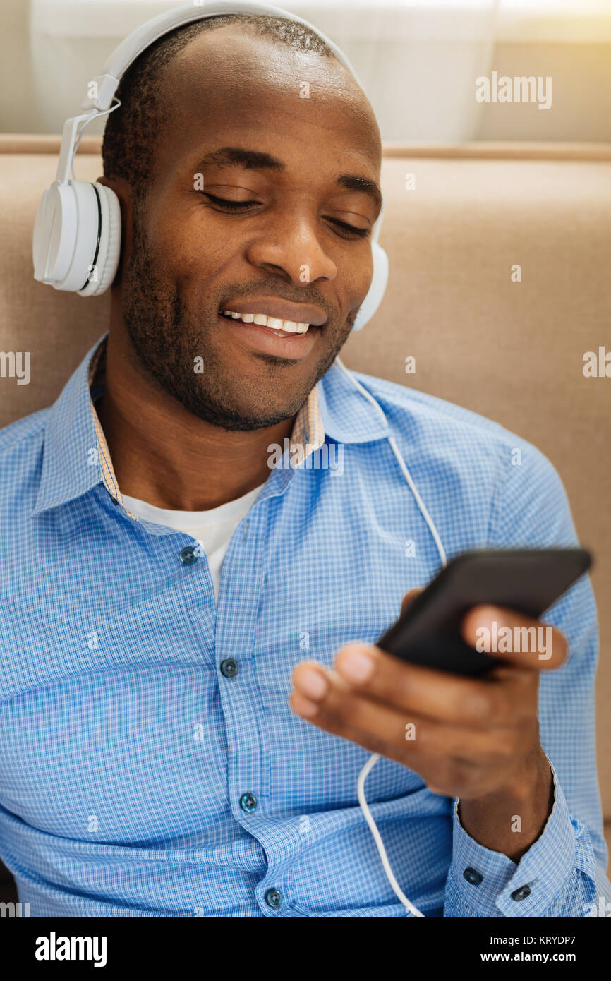 Happy man listening to music and relaxing Stock Photo - Alamy