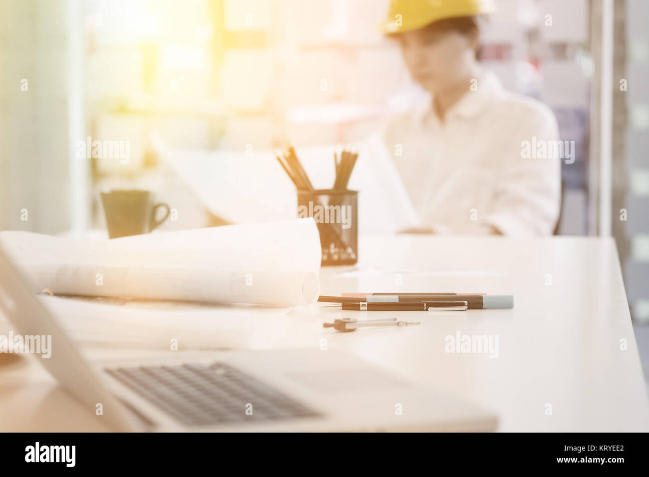 Selective Engineer table Architectural blueprints and object of ...