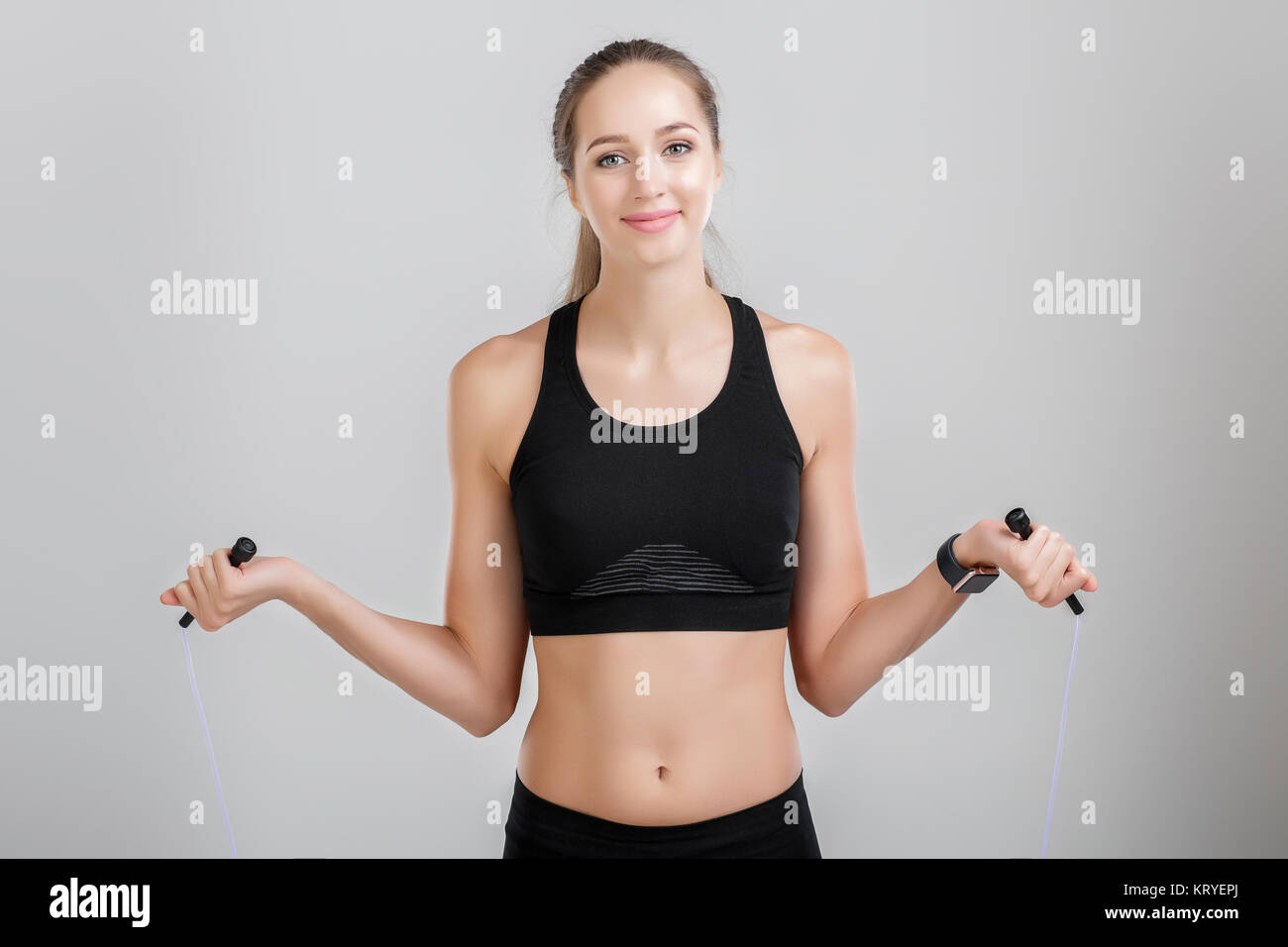athletic woman holding a rope Stock Photo - Alamy