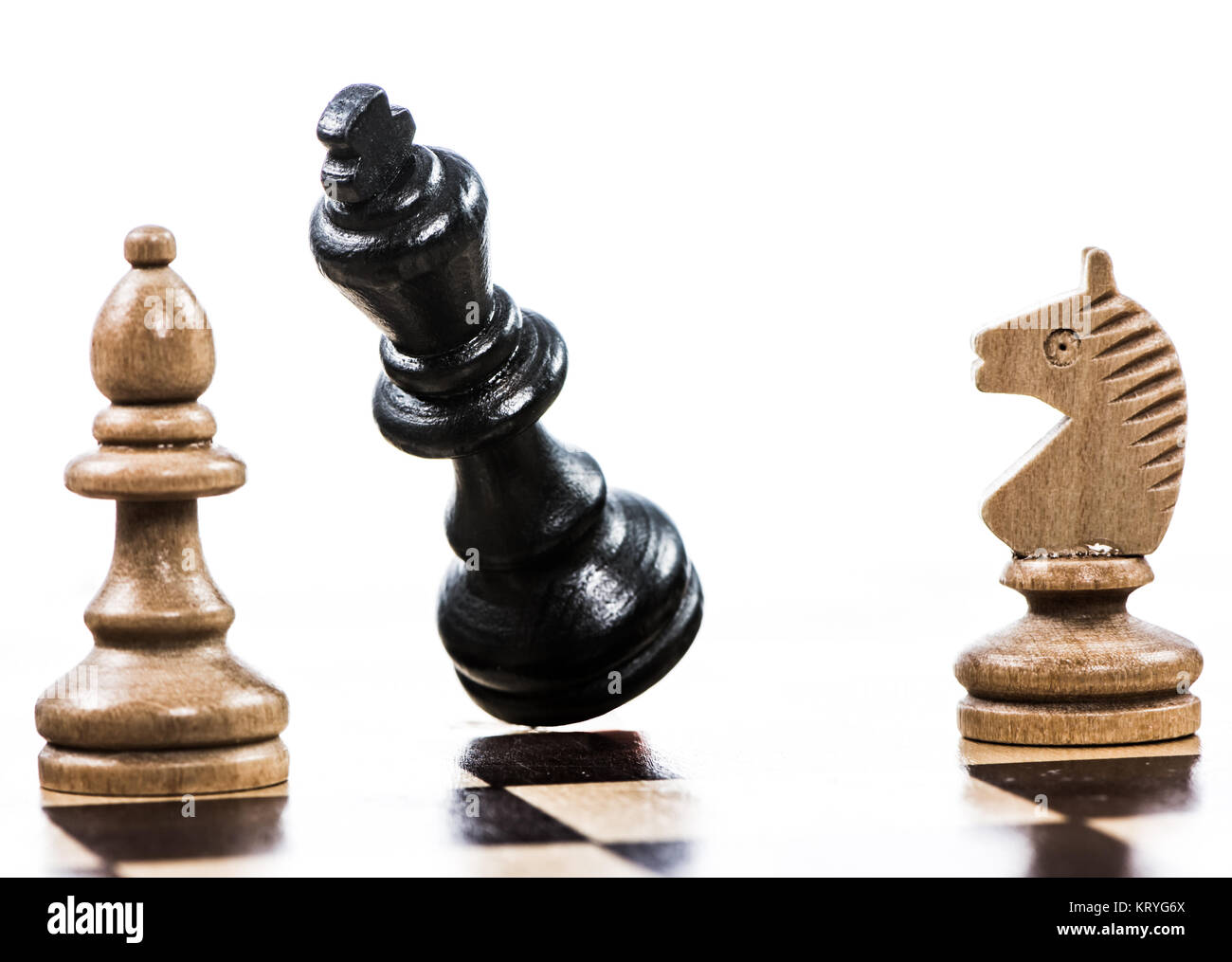 Game of chess with a falling king Stock Photo - Alamy