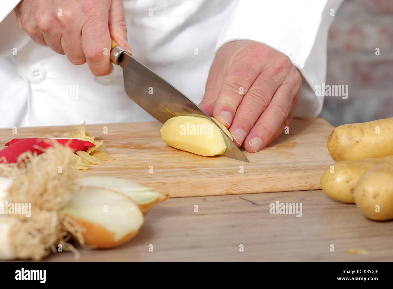detail of hands of chef slicing potatoes Stock Photo - Alamy