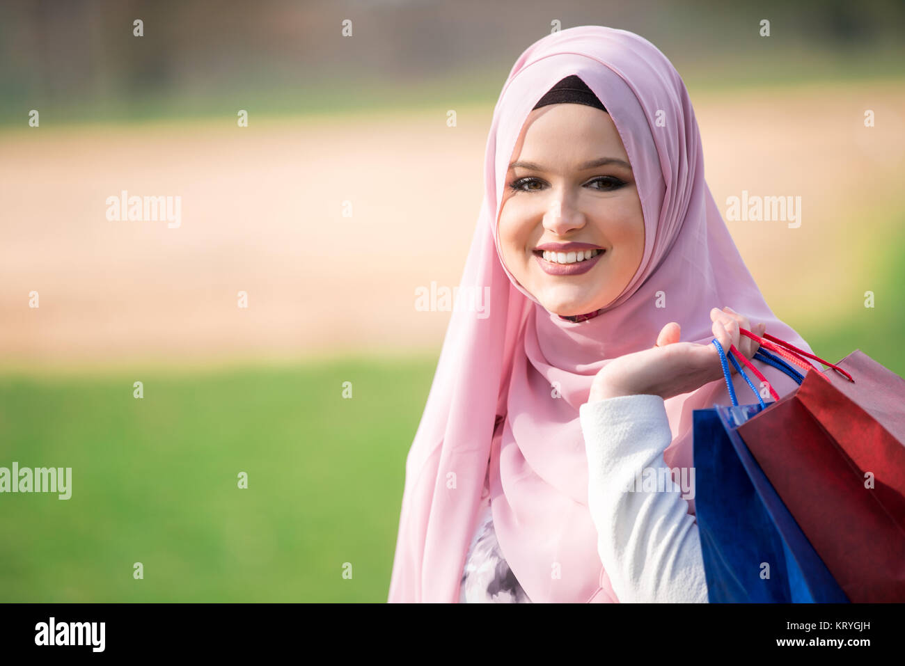 Happy muslim girl with shopping bags. conceptual Stock Photo - Alamy