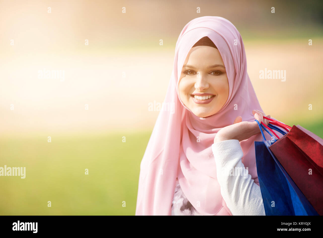 Happy muslim girl with shopping bags. conceptual Stock Photo - Alamy