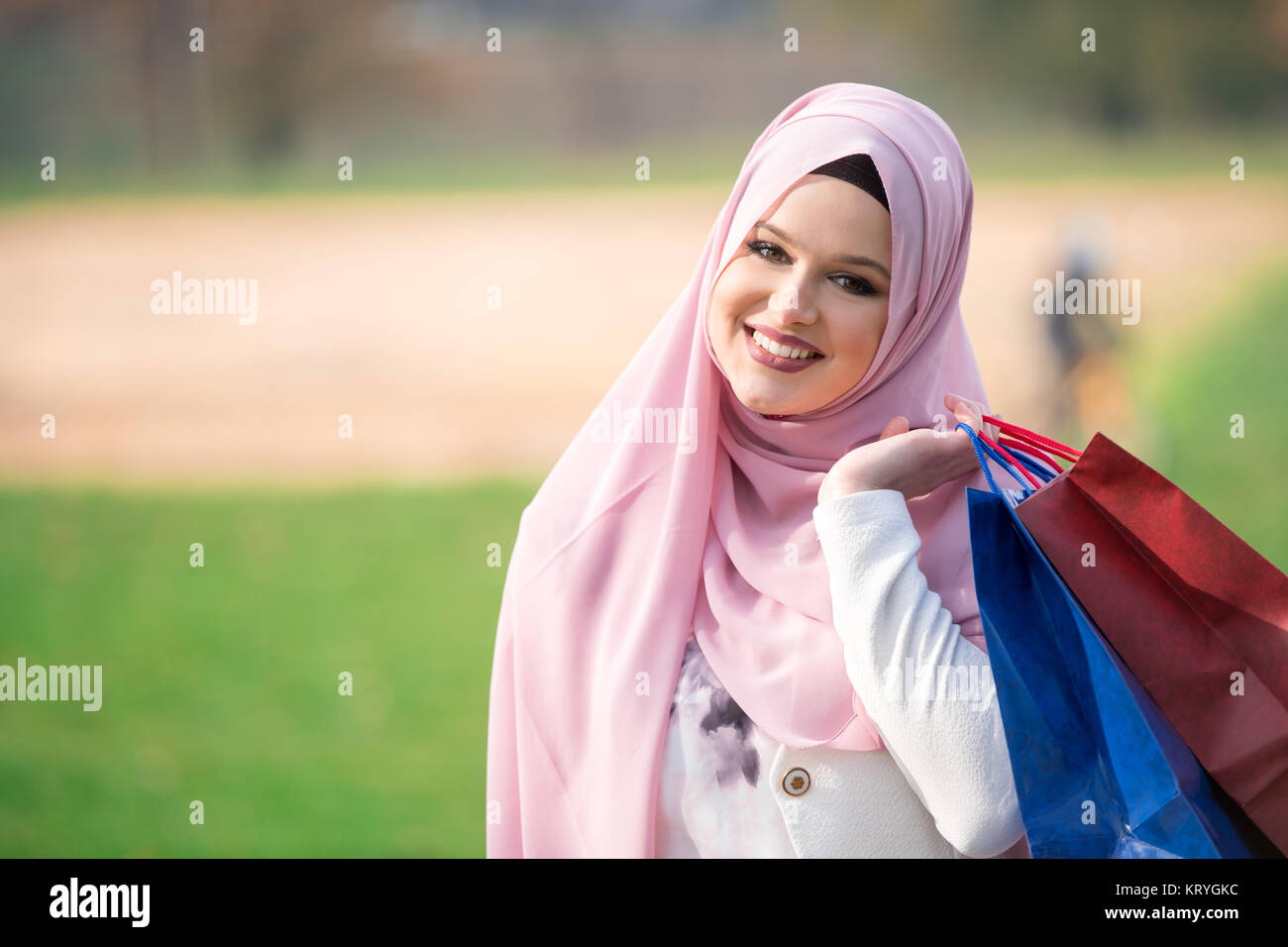 Happy muslim girl with shopping bags. conceptual Stock Photo - Alamy
