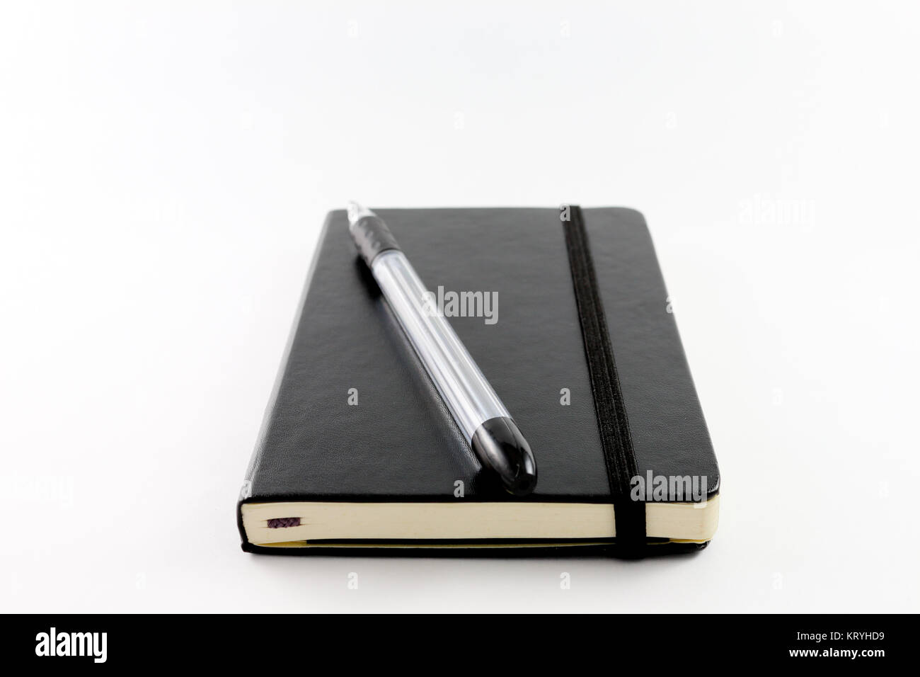 Black Notebook with pen isolated white background Stock Photo - Alamy