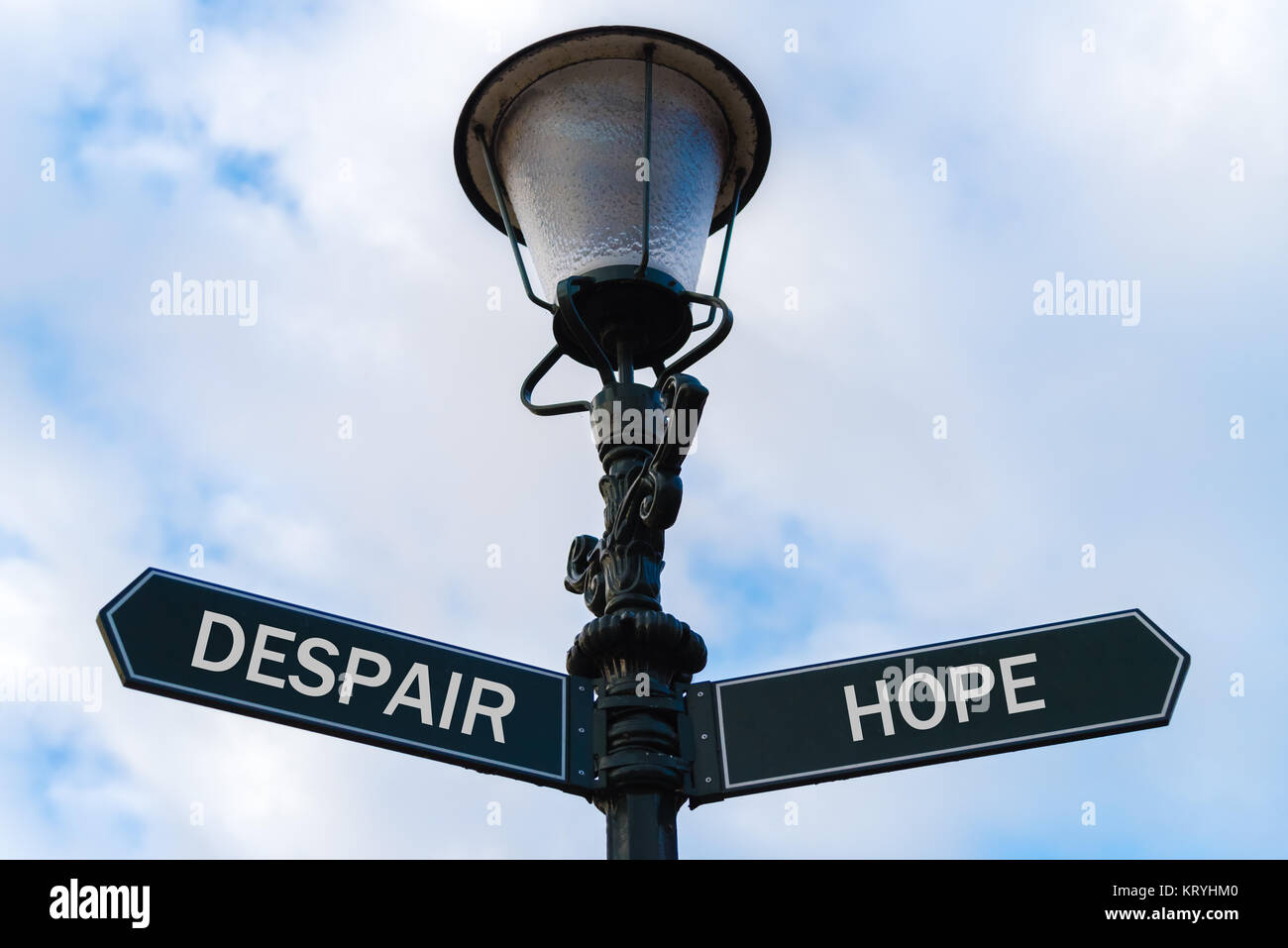 Despair versus Hope directional signs on guidepost Stock Photo - Alamy
