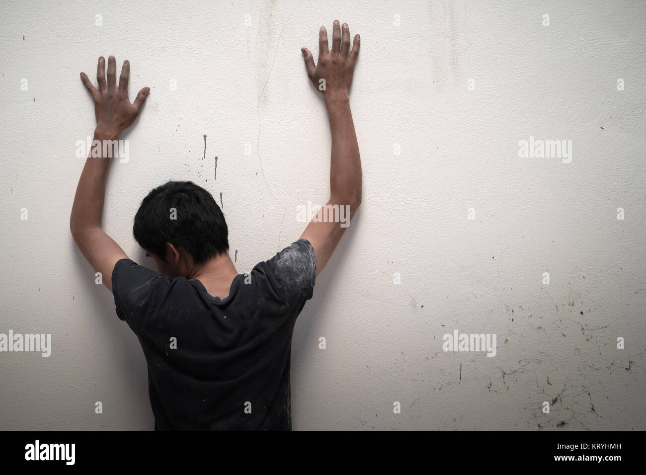 man show hands up facing the wall Stock Photo - Alamy