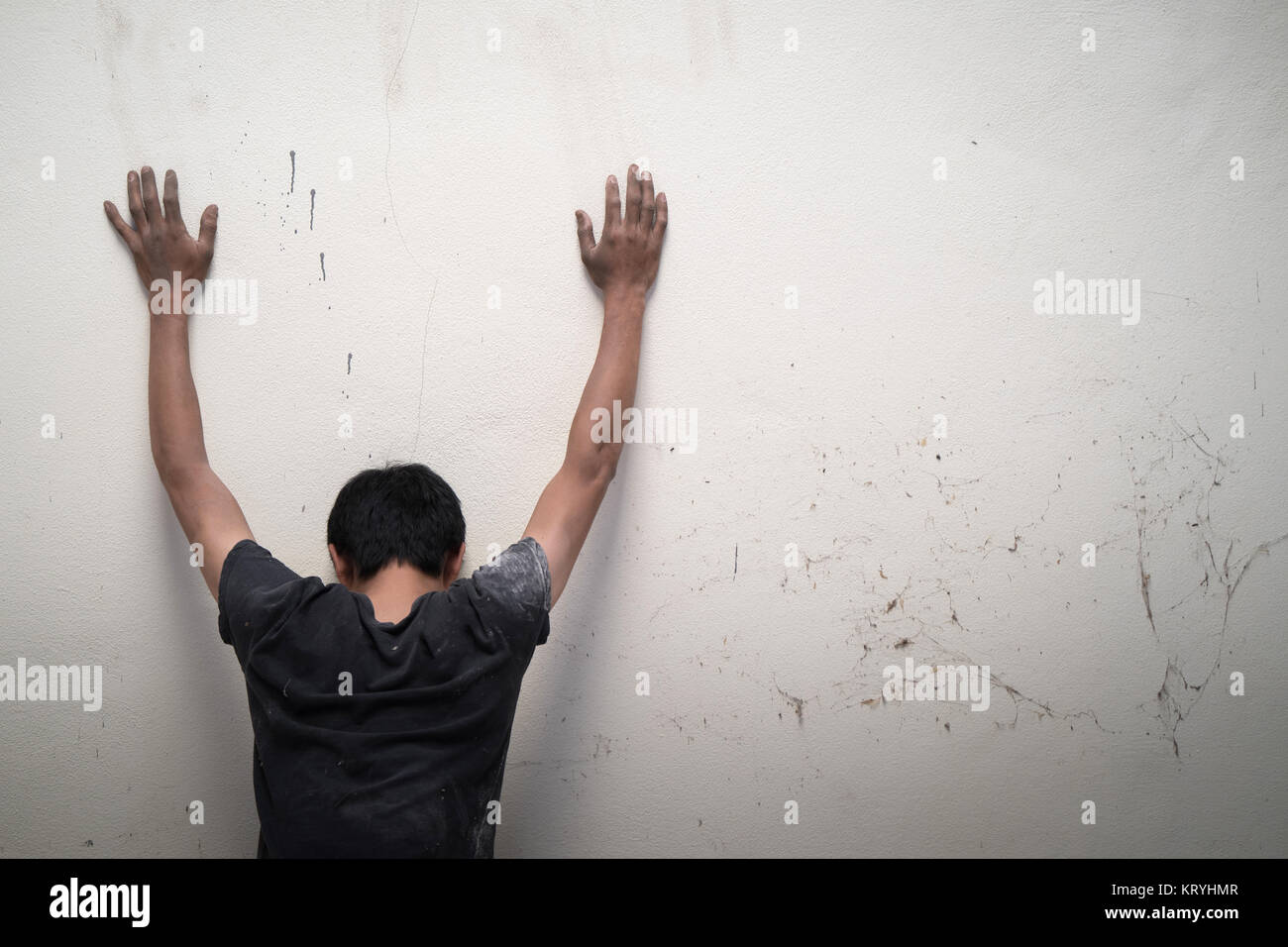 man show hands up facing the wall Stock Photo - Alamy
