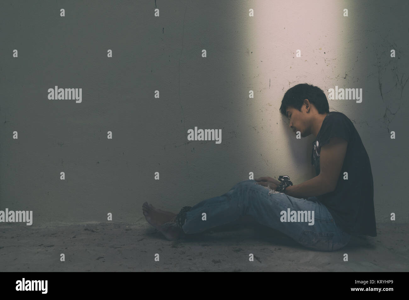 hopeless man hands tied together with rope Stock Photo - Alamy