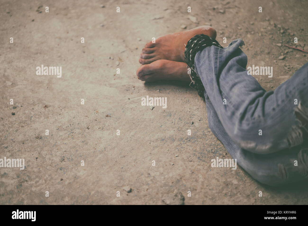 hopeless man feet tied together with rope Stock Photo - Alamy