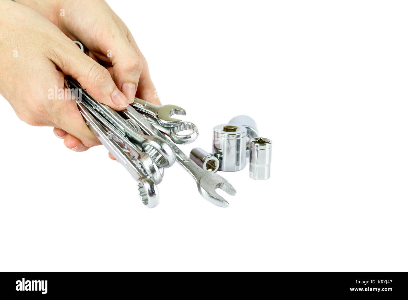 Hand holding a bunch of working tools Stock Photo - Alamy