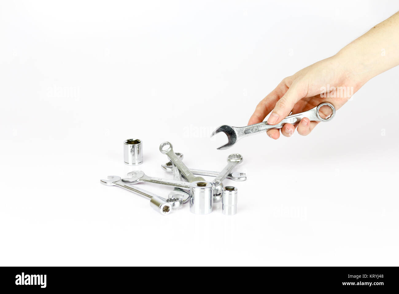 Hand holding a bunch of working tools Stock Photo - Alamy