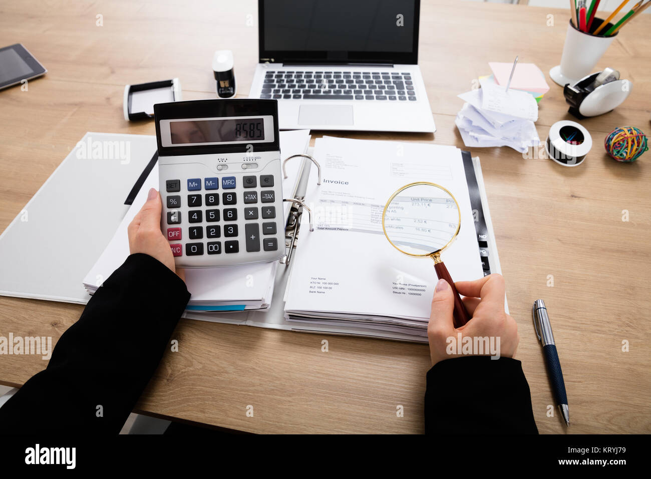 Businesswoman Calculating Invoice Using Calculator Stock Photo - Alamy