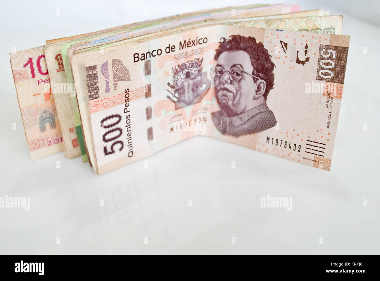 A stack of Mexican Pesos bills isolated on white background Stock Photo ...