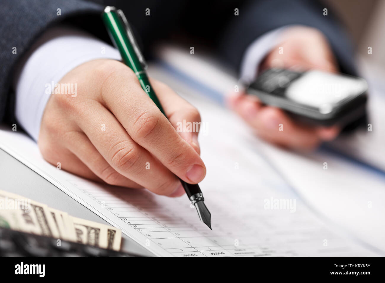 Working business man hand pen writing paper document at office ...