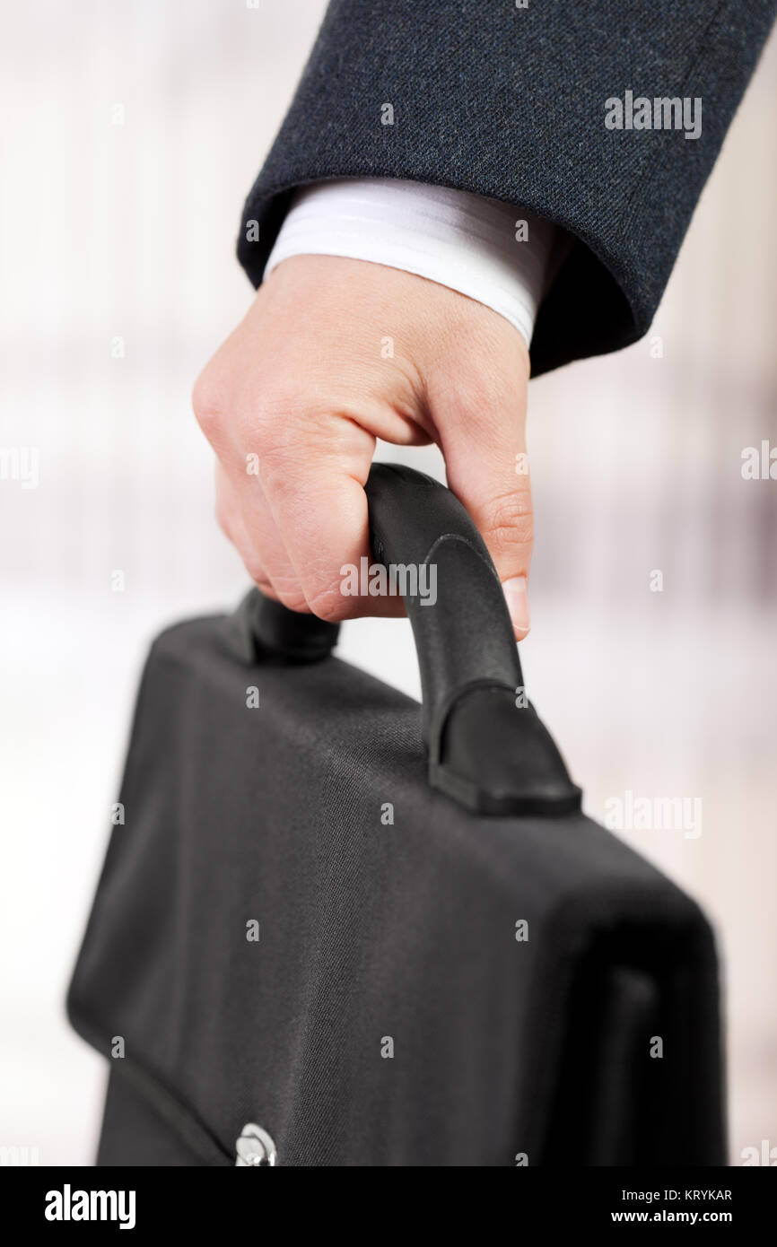Hand holding briefcase hi-res stock photography and images - Alamy