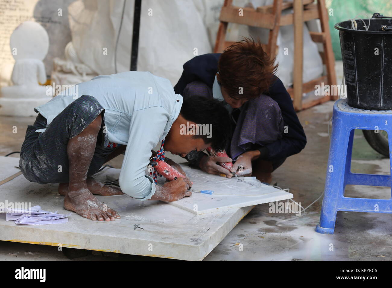 Scenes of the stone-masons busily cutting and polishing marble in the ...