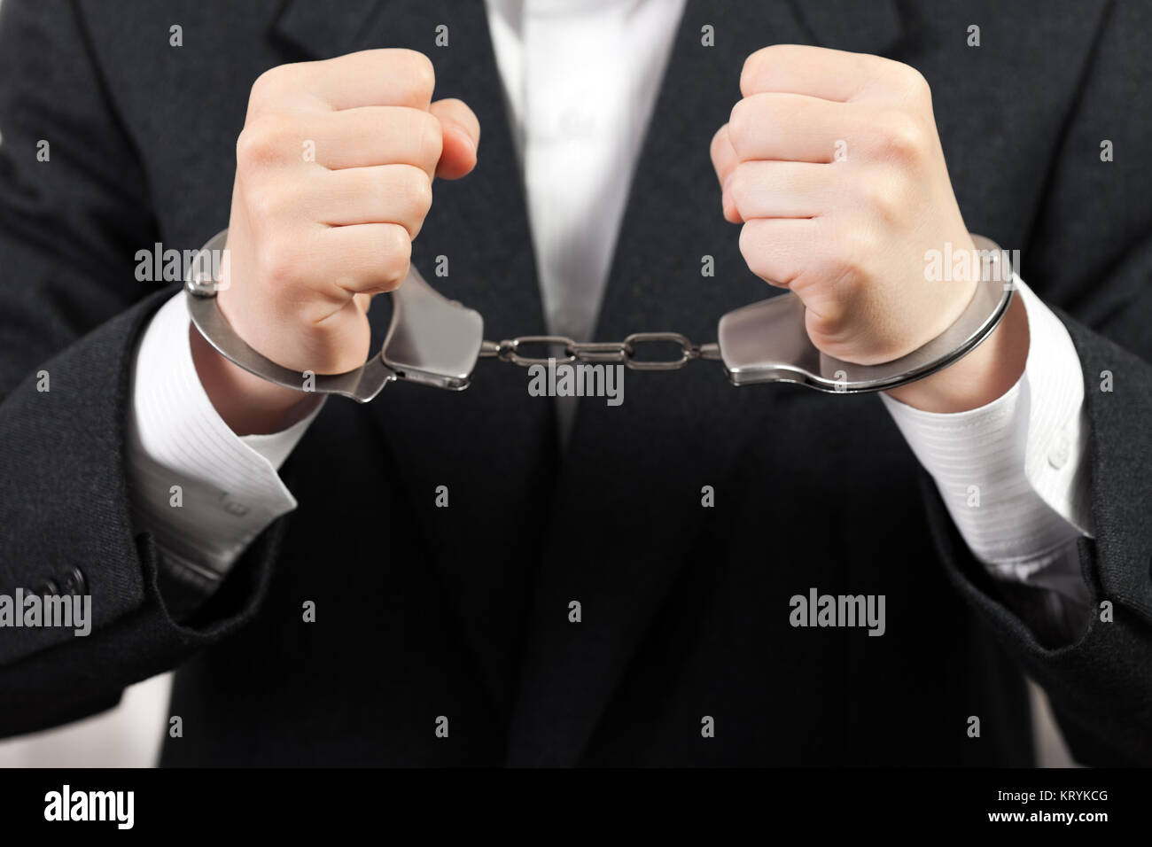 Police steel handcuffs arrests business men hands Stock Photo - Alamy