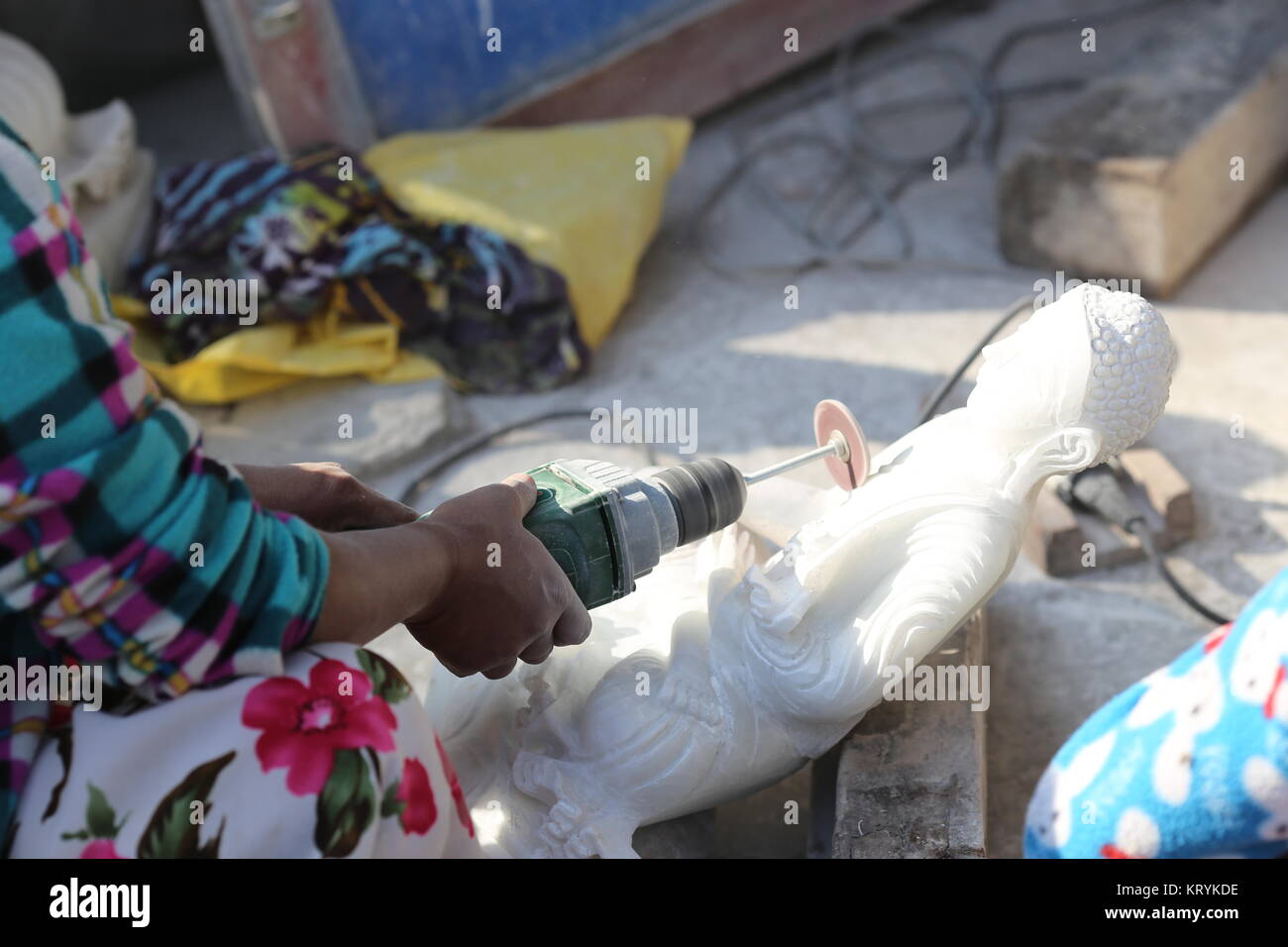 Scenes of the stone-masons busily cutting and polishing marble in the ...