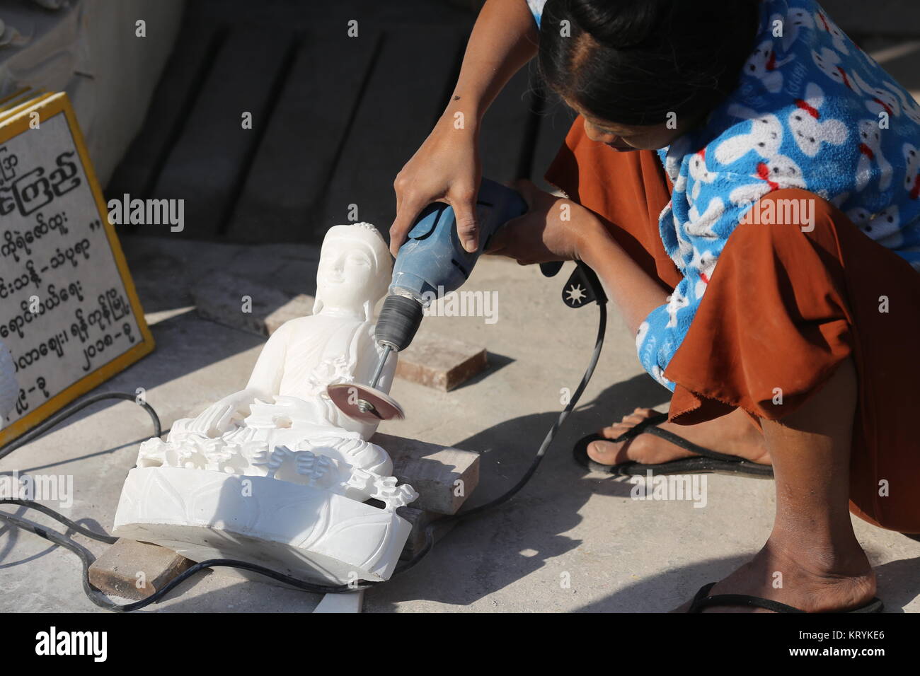 Scenes of the stone-masons busily cutting and polishing marble in the ...