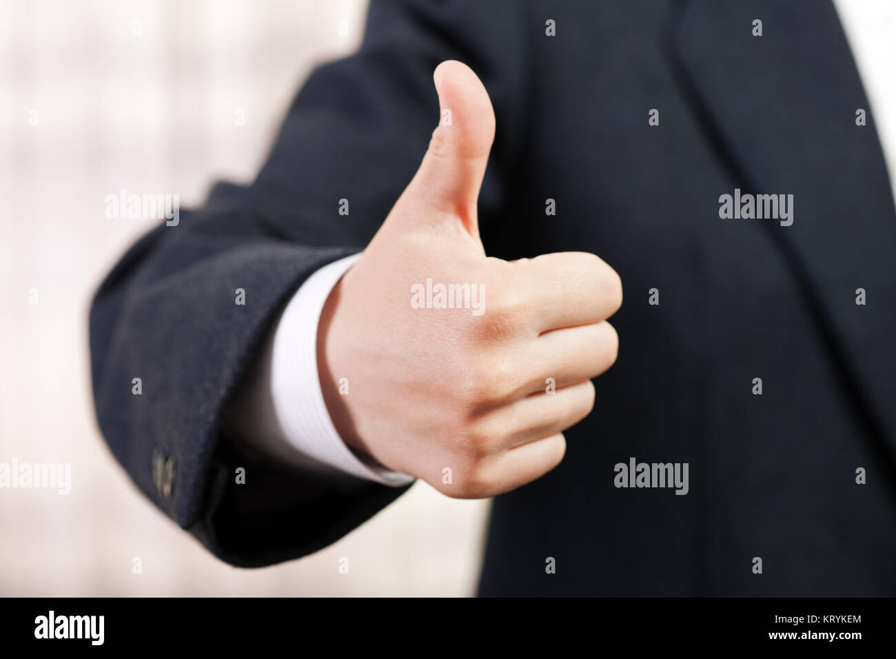 Business men hand gesturing thumb up success sign Stock Photo - Alamy