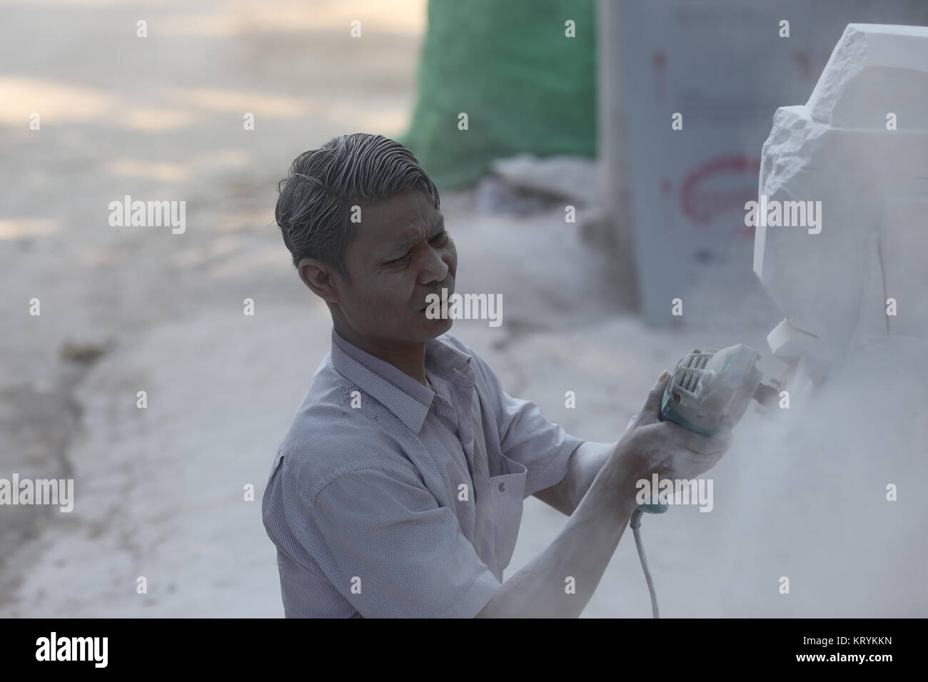 Scenes of the stone-masons busily cutting and polishing marble in the ...
