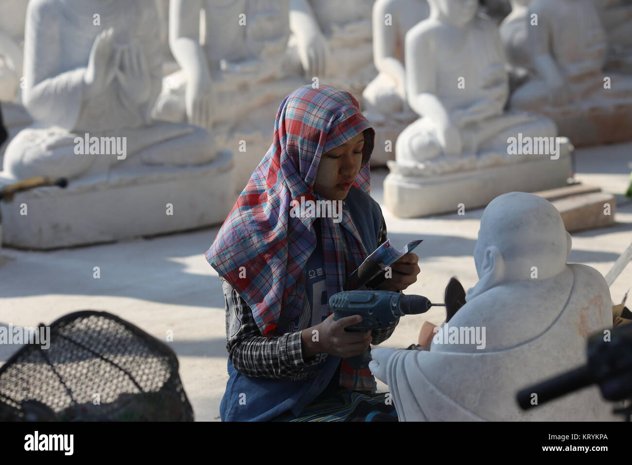Scenes of the stone-masons busily cutting and polishing marble in the ...
