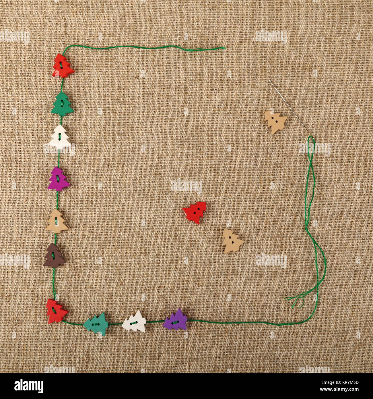 Christmas template of craft buttons over canvas Stock Photo - Alamy