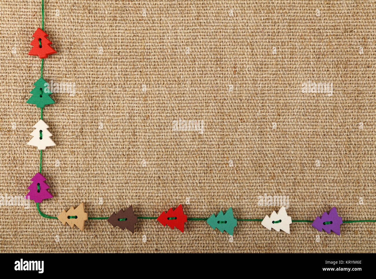 Christmas template of craft buttons over canvas Stock Photo - Alamy