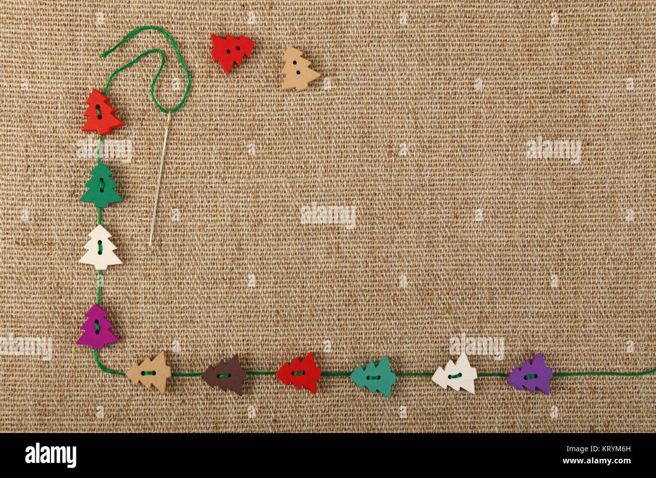 Christmas template of craft buttons over canvas Stock Photo - Alamy