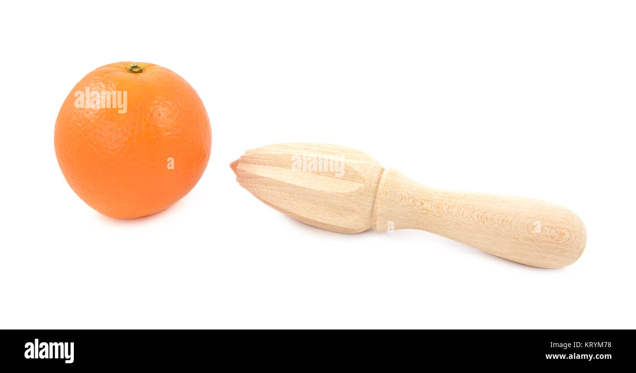 Whole orange and wooden citrus reamer Stock Photo - Alamy