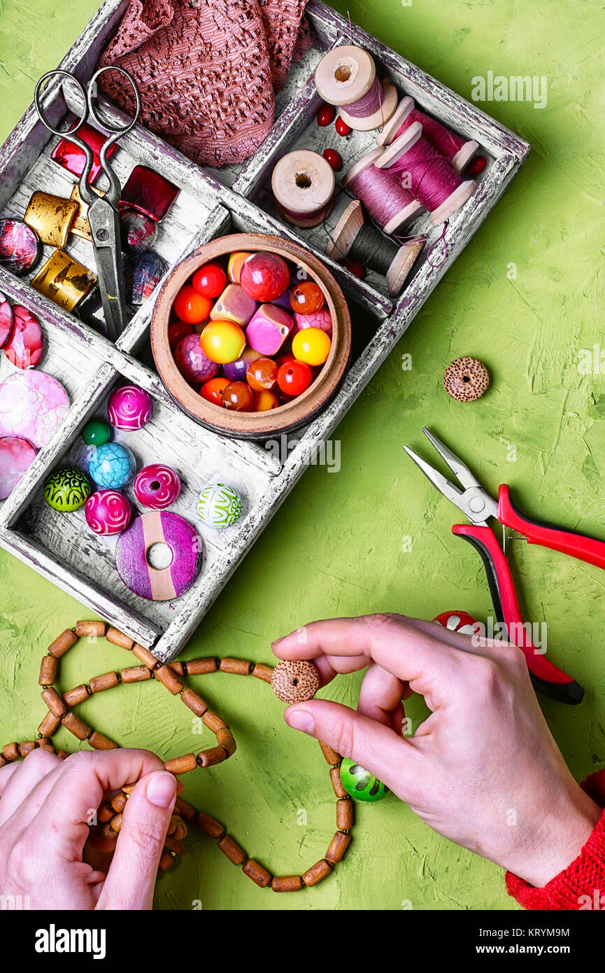 Women hands collecting the bracelets and beads Stock Photo - Alamy