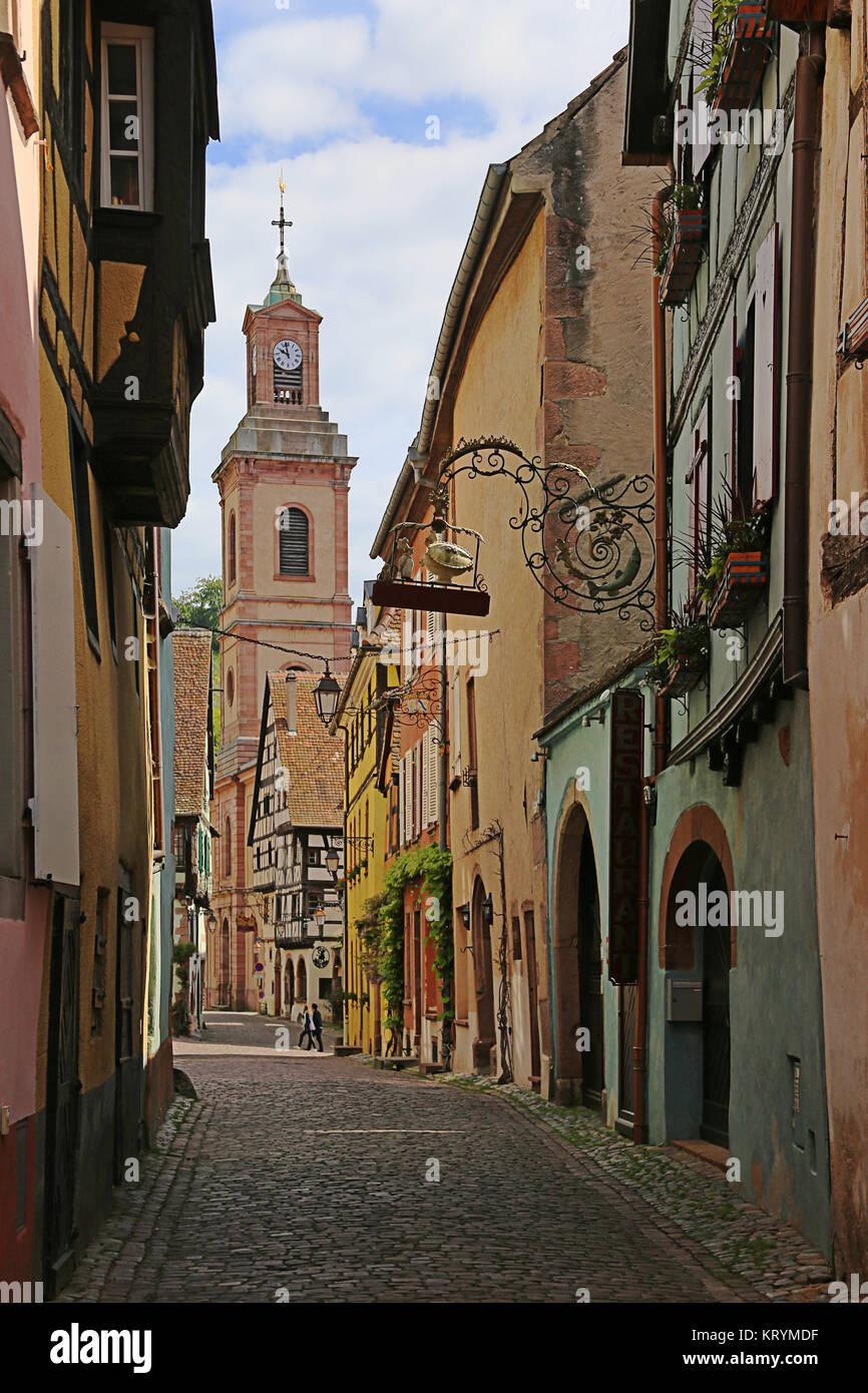 narrow alley in the wine village riquewihr in alsace Stock Photo - Alamy