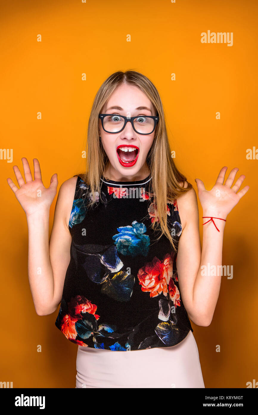 Portrait of young woman with shocked facial expression Stock Photo - Alamy