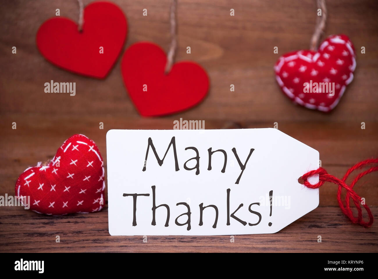 Label With English Text Many Thanks. White Label With Red Textile ...