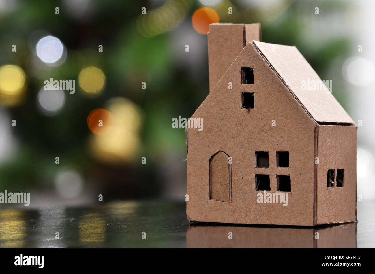 Miniature paper house Stock Photo - Alamy