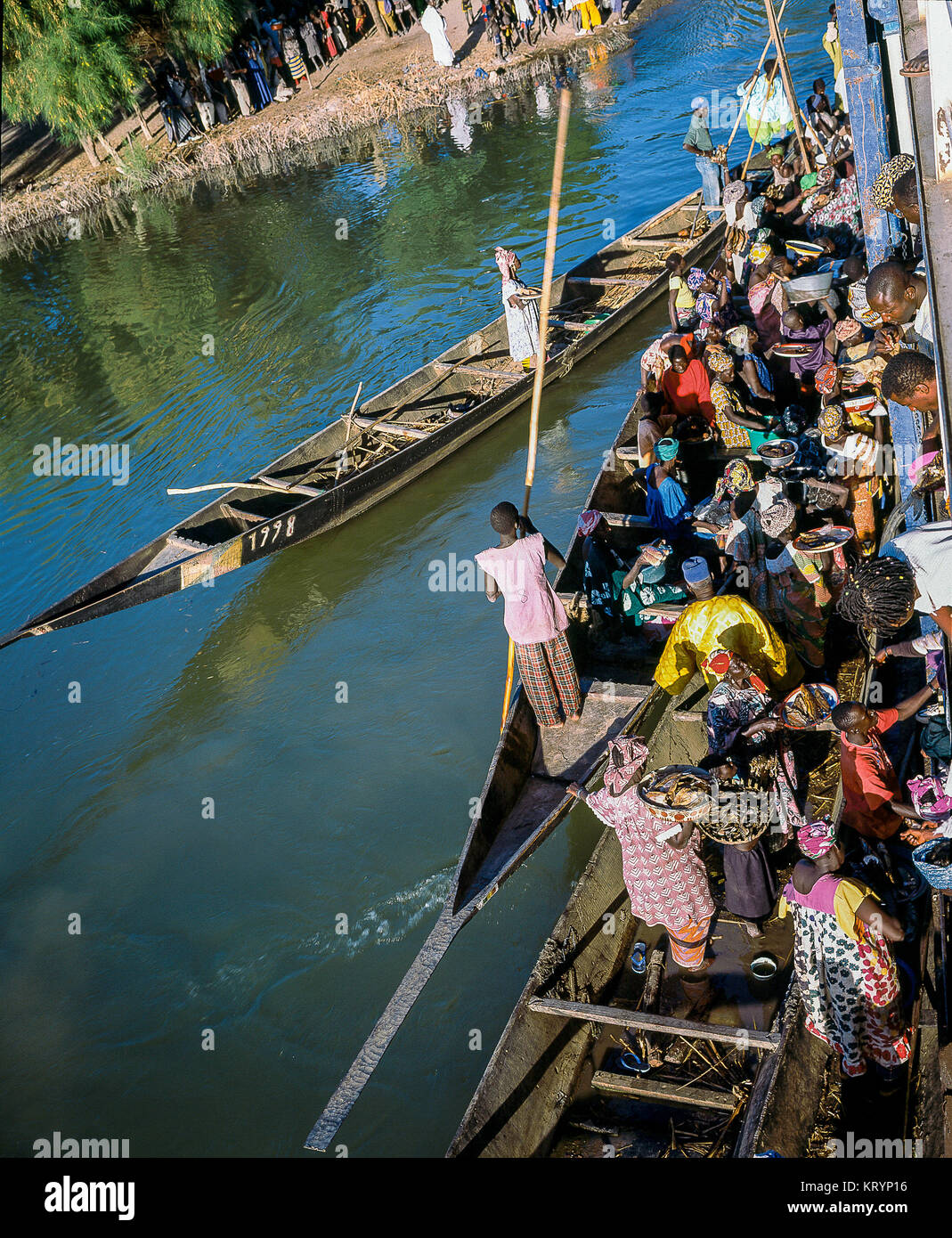 Elevated view of market and pirogues on the bank of the Niger river ...