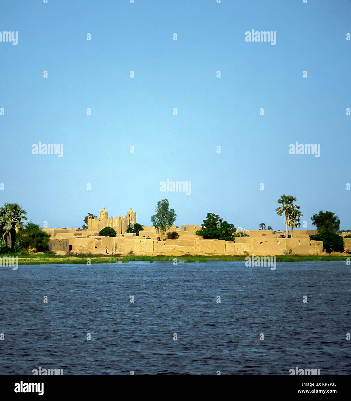View of a village by the Niger river and adobe buildings, Mali Stock ...