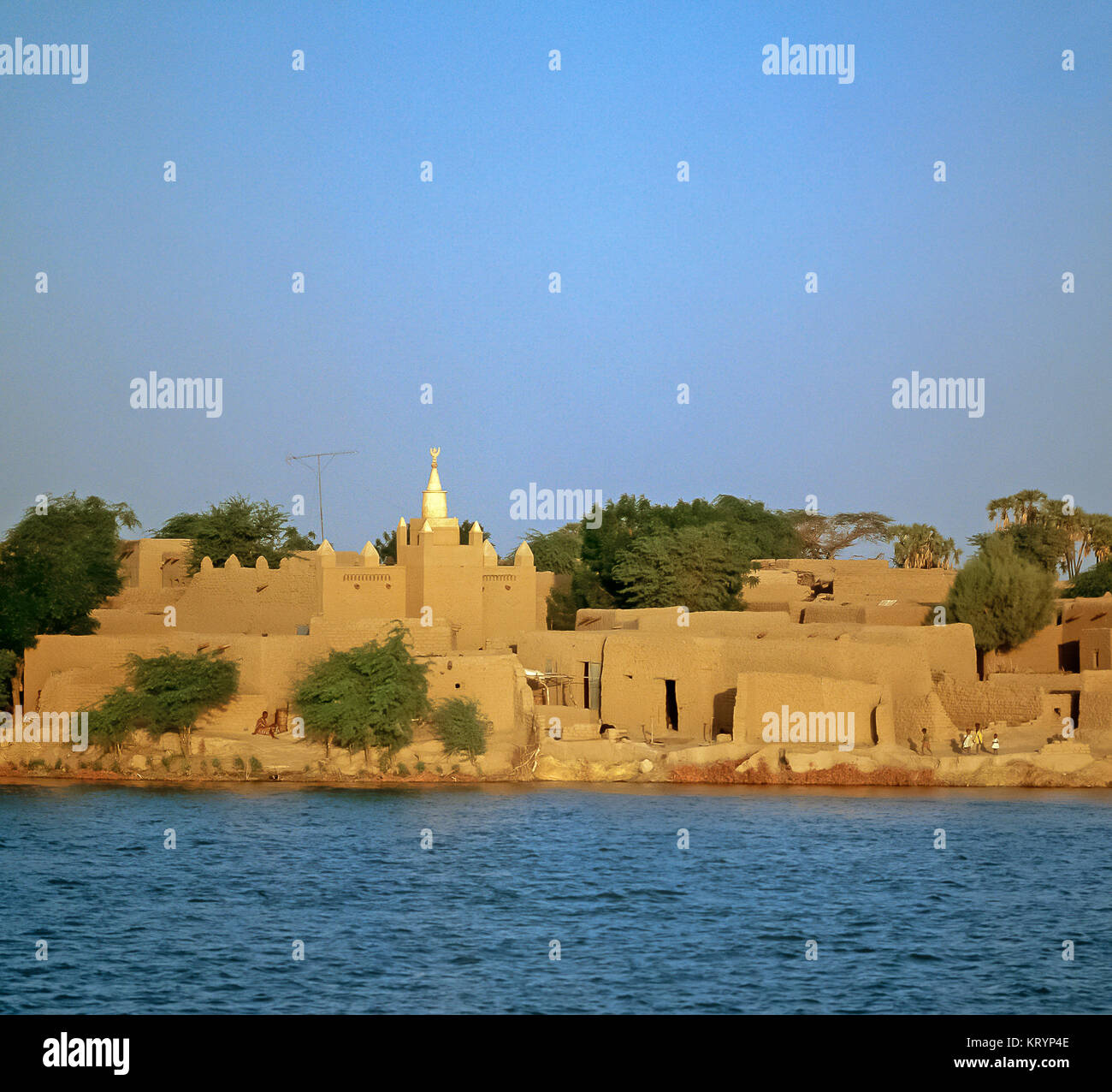 View of a village by the Niger river and adobe buildings, Mali Stock ...