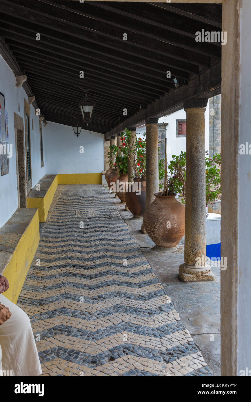 Colonnade Courtyard with Cobblestone Floor and Ornamental Vase Stock ...
