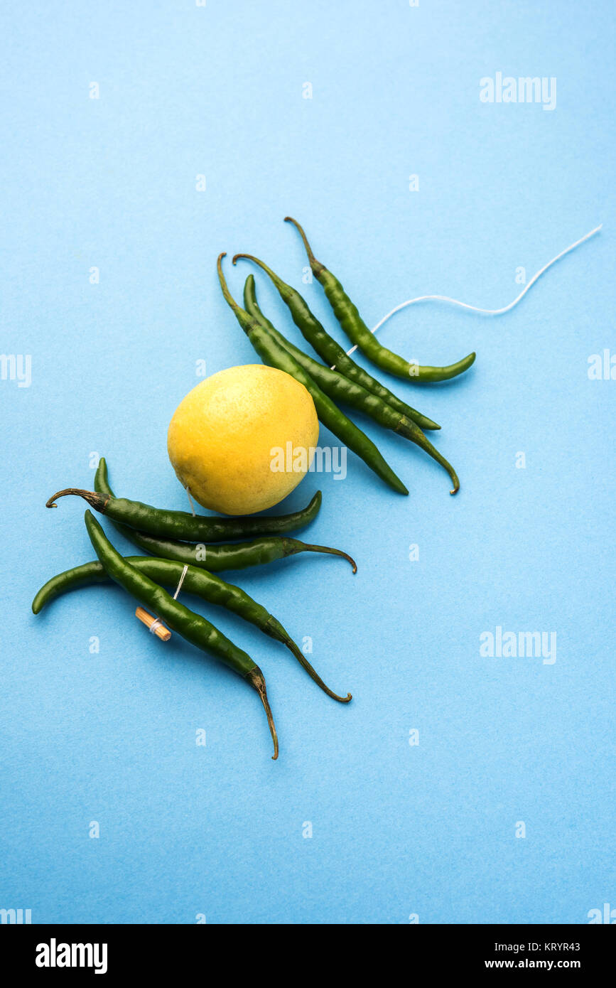 lemon chilies hanging - Indian superstitious lemon and green chillies ...