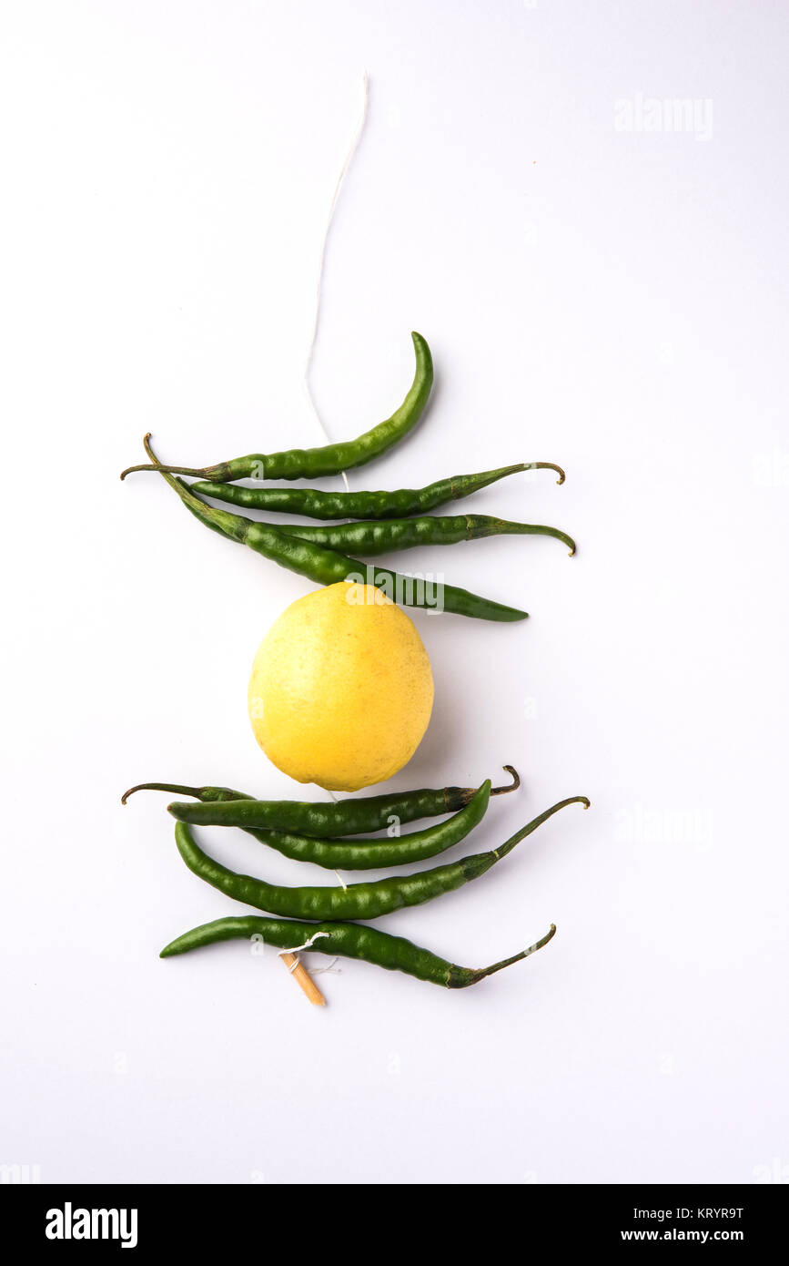 lemon chilies hanging - Indian superstitious lemon and green chillies ...