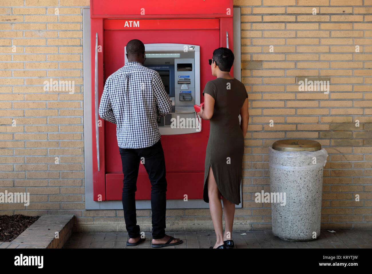 Male person rear back view people withdrawing cash at US Bank of ...